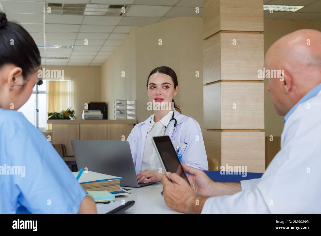 team doctor, nurse and internship doctor talking and discussing about ...