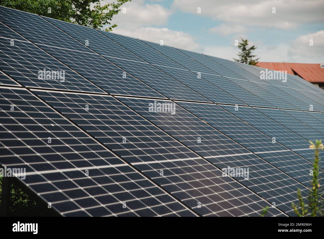 solar panels in front yard, free energy factory, offgid Stock Photo - Alamy