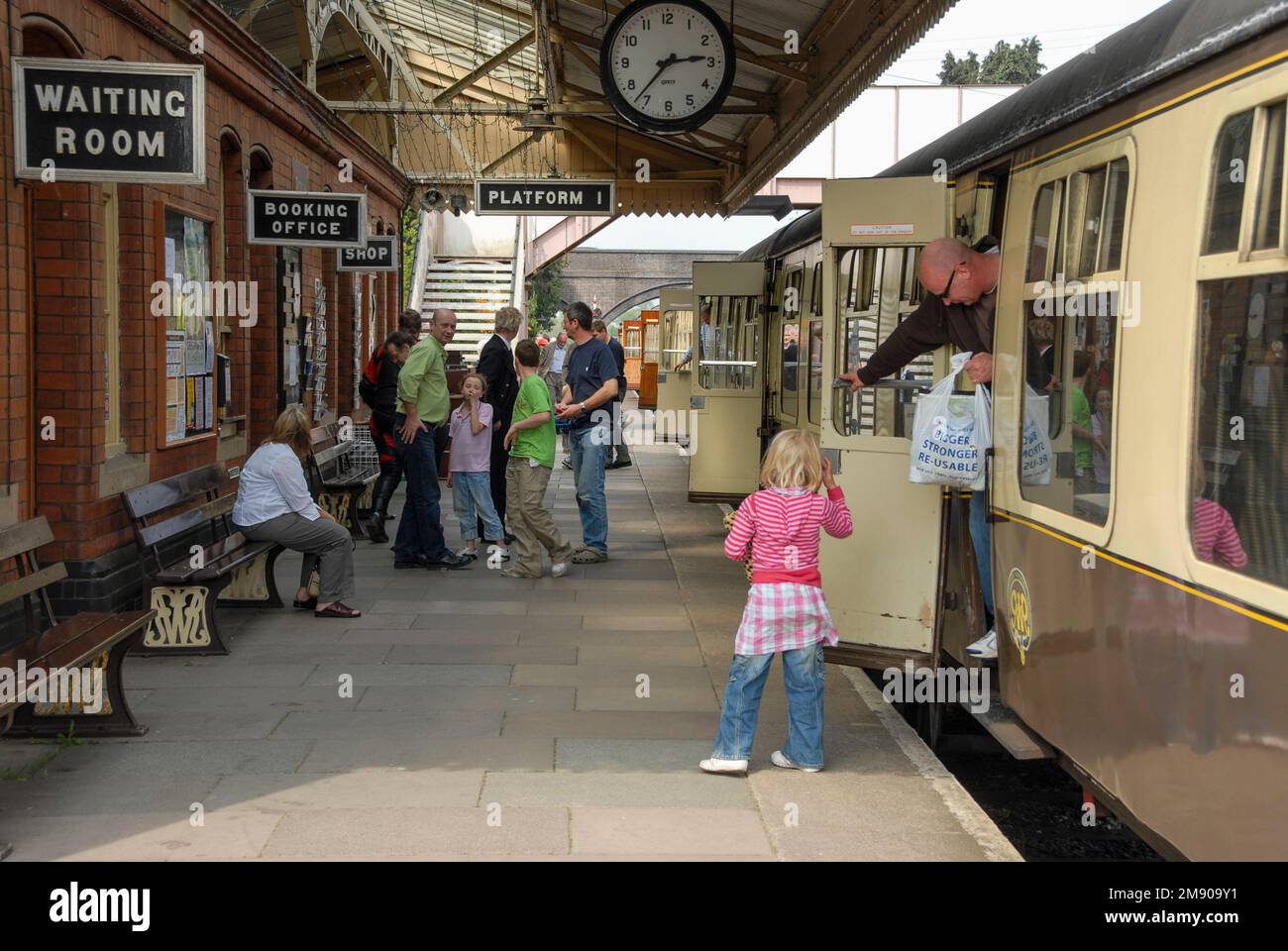 Train passengers alight from a fleet of vintage rail carriages at ...