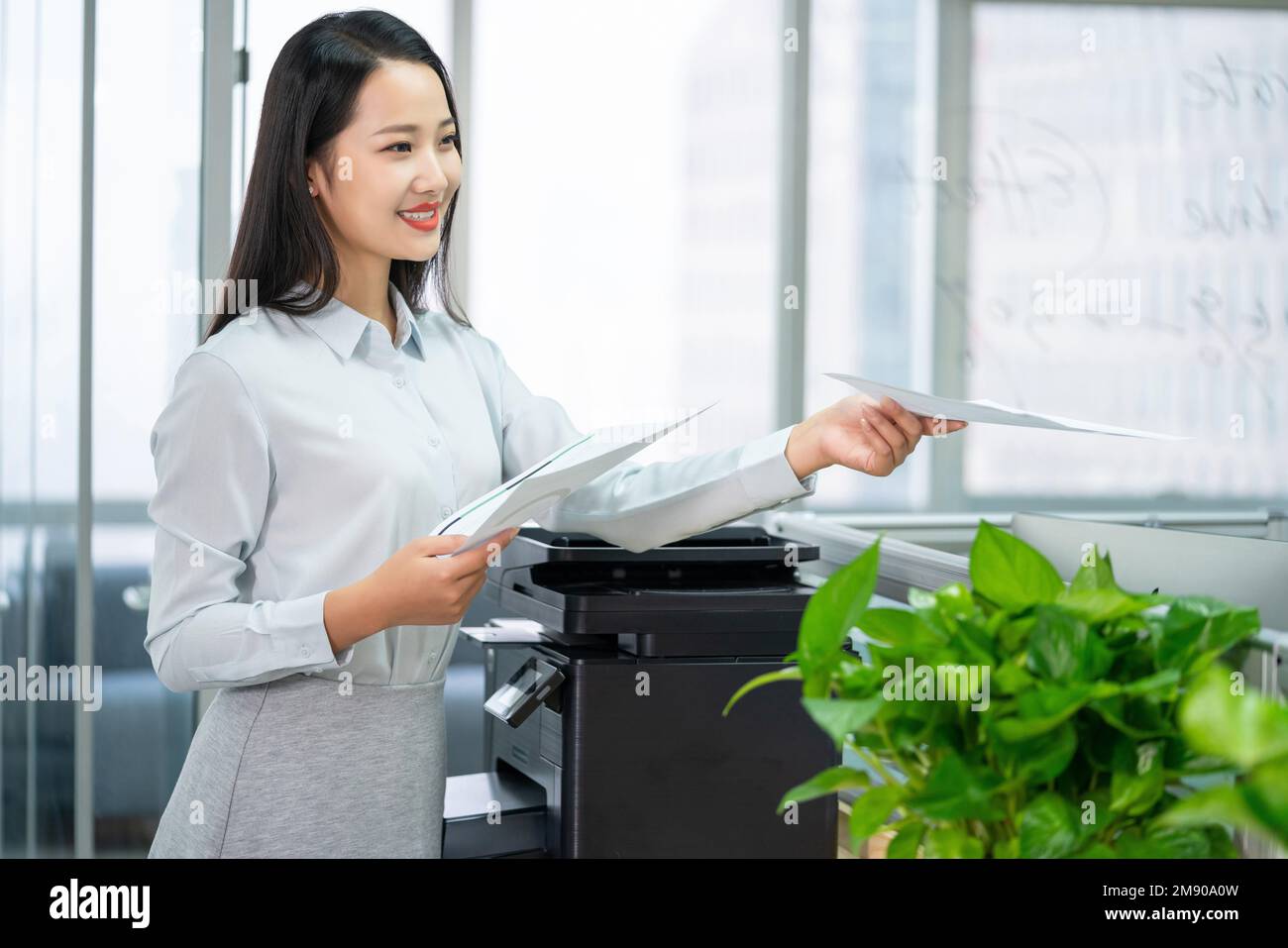 Young business lady printer hi-res stock photography and images - Alamy