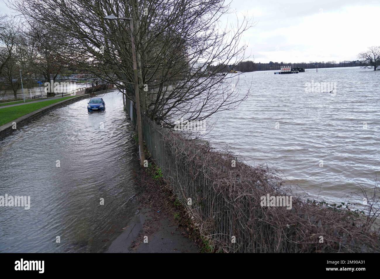 A stranded vehicle by the flooded Worcester racecourse, after days of ...
