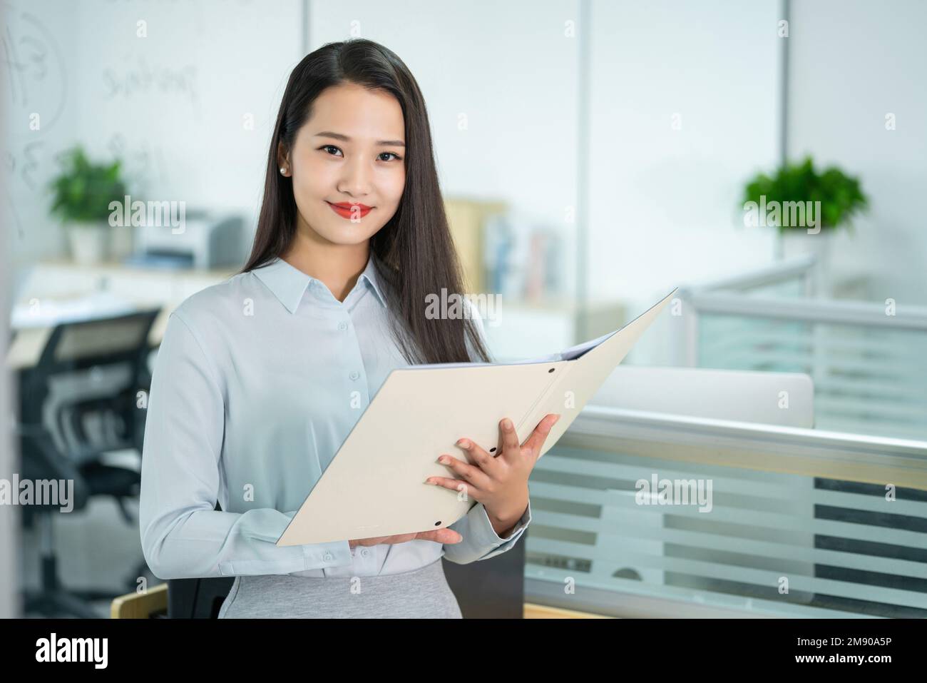 Holding a documents folder hi-res stock photography and images - Alamy