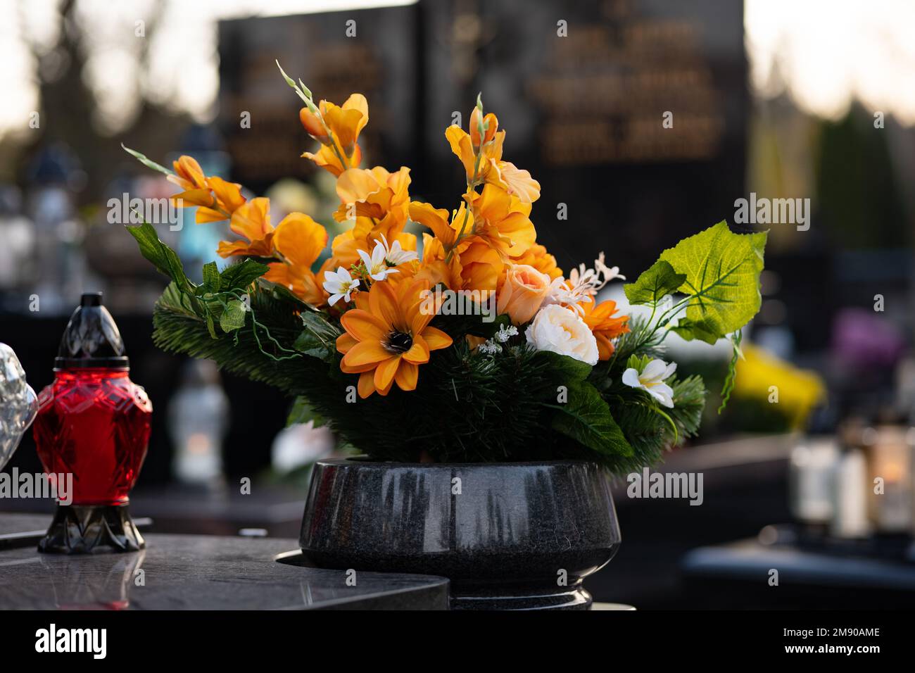 The flowers and candles at the grave, Grief and paying respect for a dead person Stock Photo - Alamy