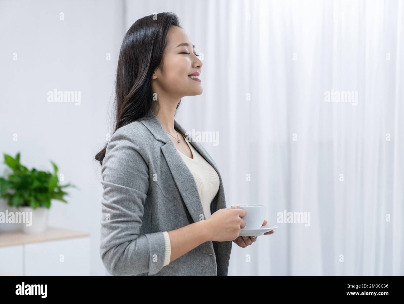 Business woman drink coffee Stock Photo - Alamy