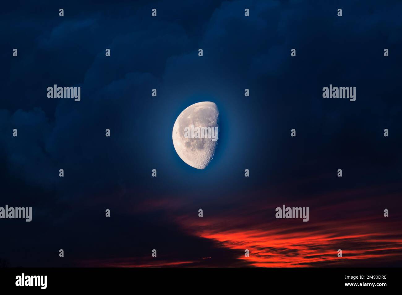 Beautiful waning moon lighting up a beautiful dark sky Stock Photo - Alamy