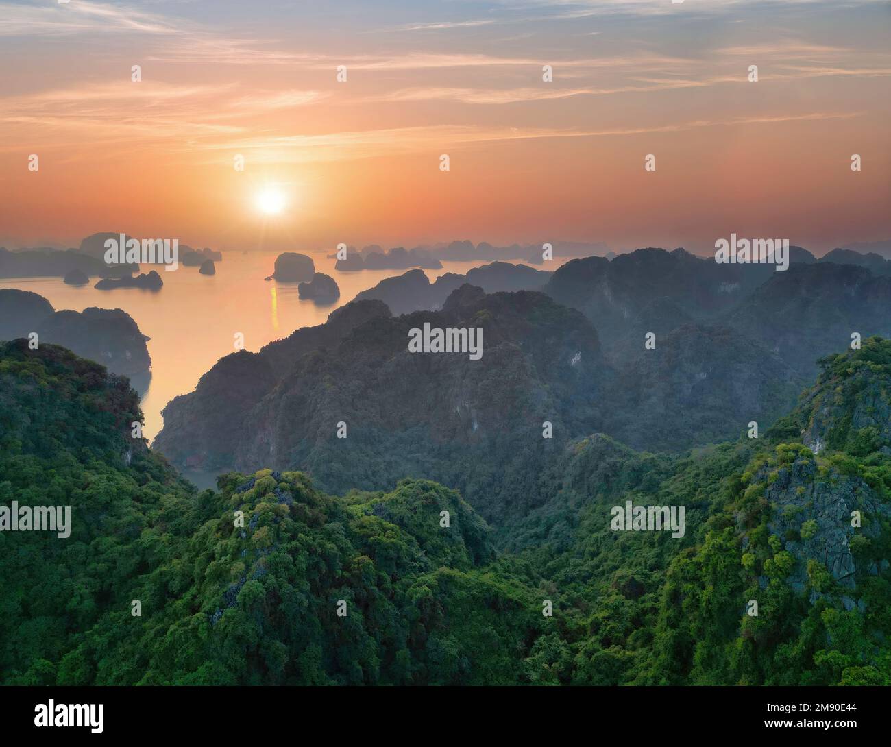 Stunning sunset of Halong Bay, Bai Tu Long Bay in Vietnam Stock Photo ...