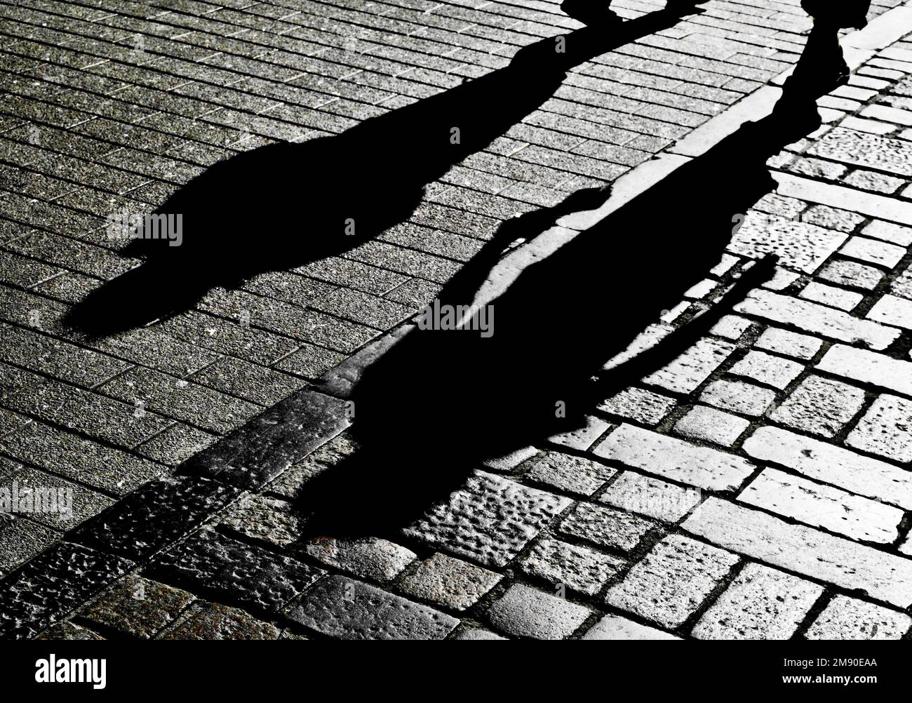 Human shadows on the ground hi-res stock photography and images - Alamy