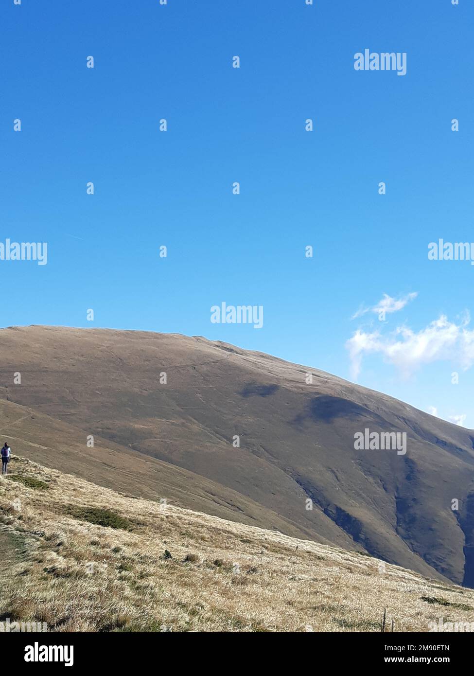 A vertical high-angle of a landscape view with mountains against clear ...