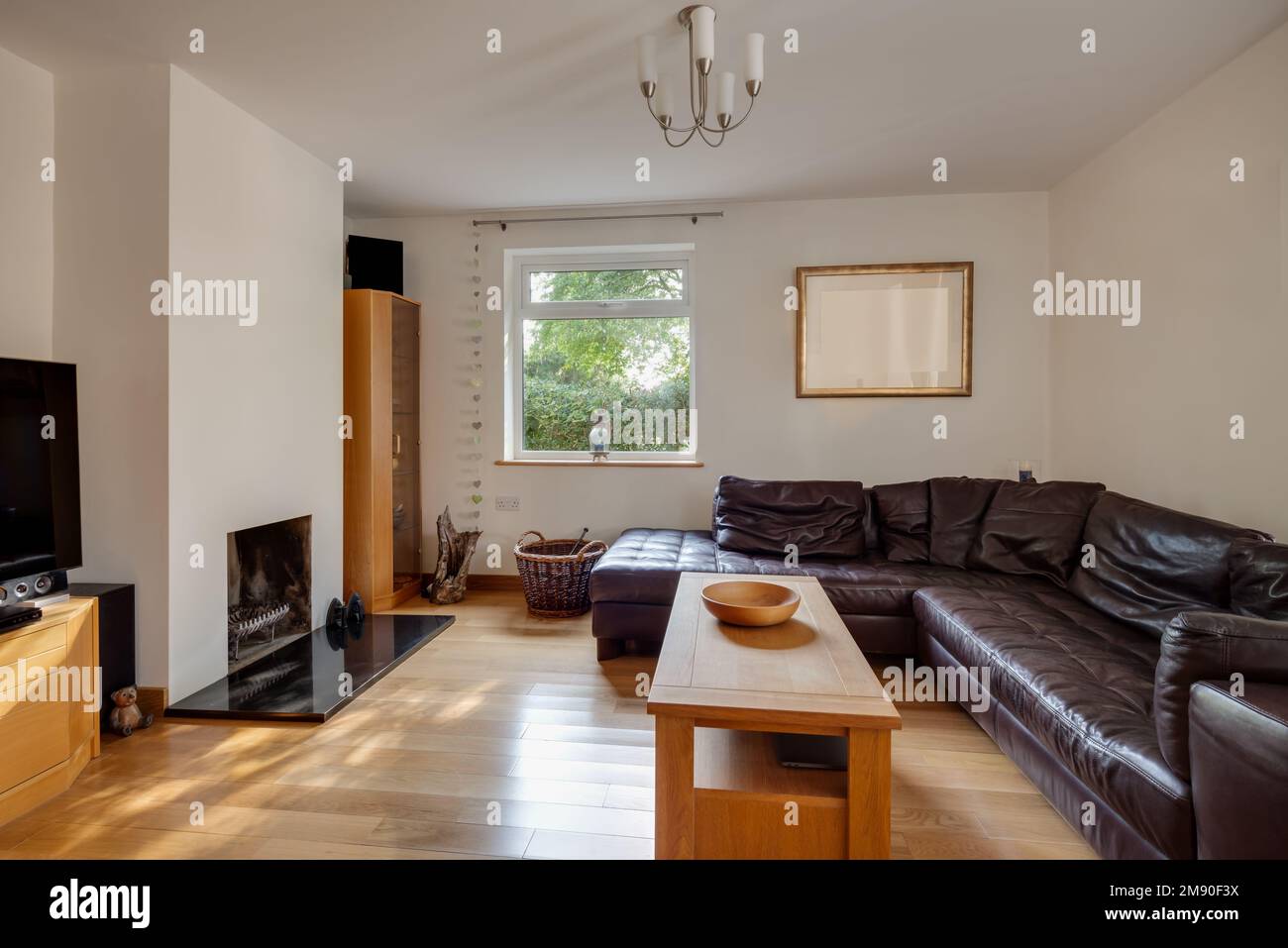 Modern contemporary furnished living room with wooden floors television ...