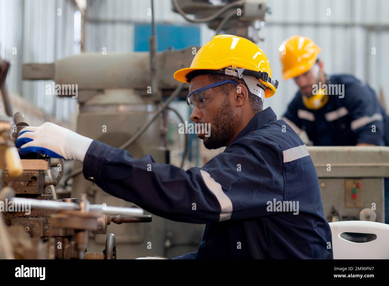 Black male worker lathe operator hi-res stock photography and images ...