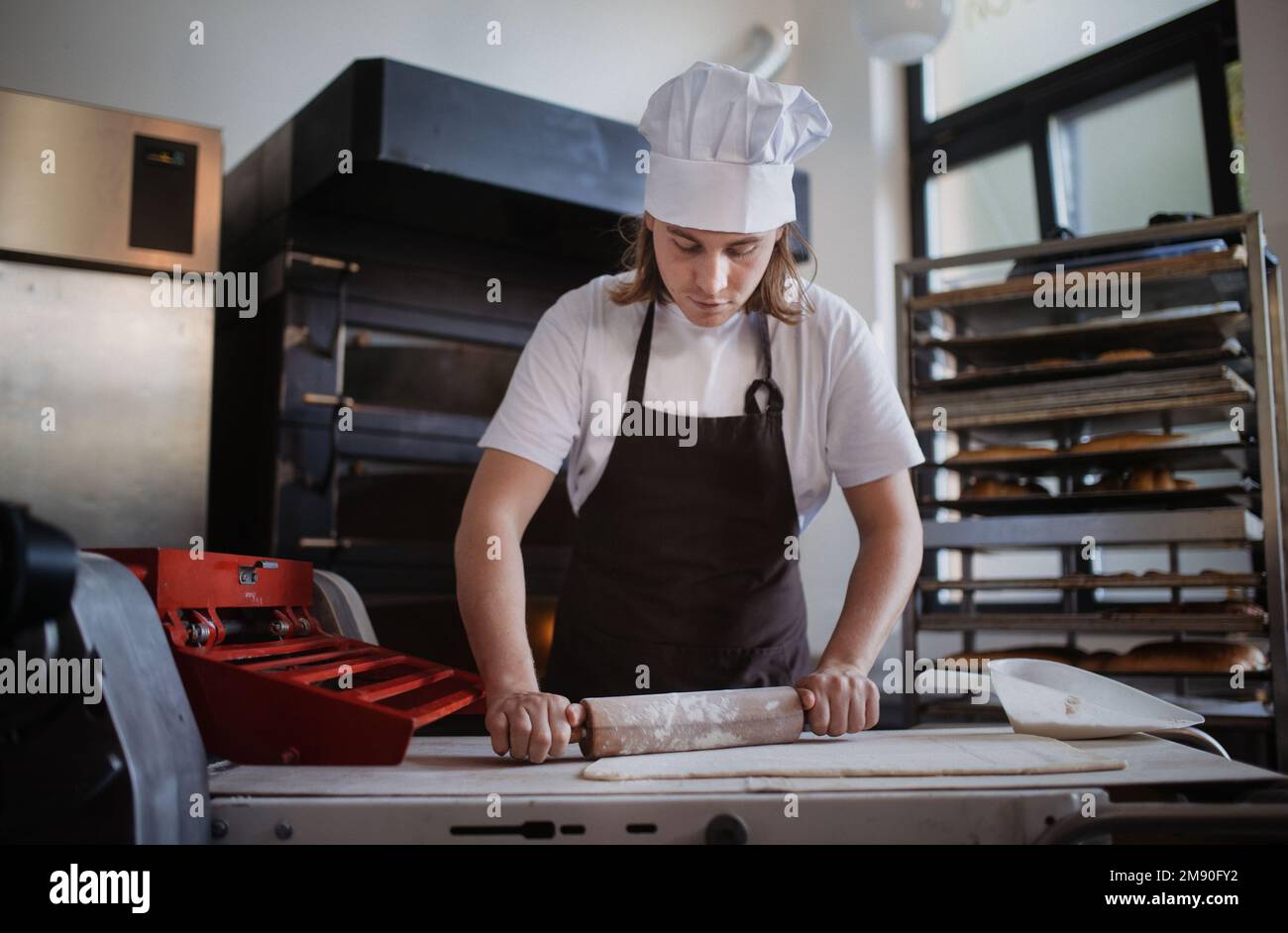 Positive young man baker hi-res stock photography and images - Alamy