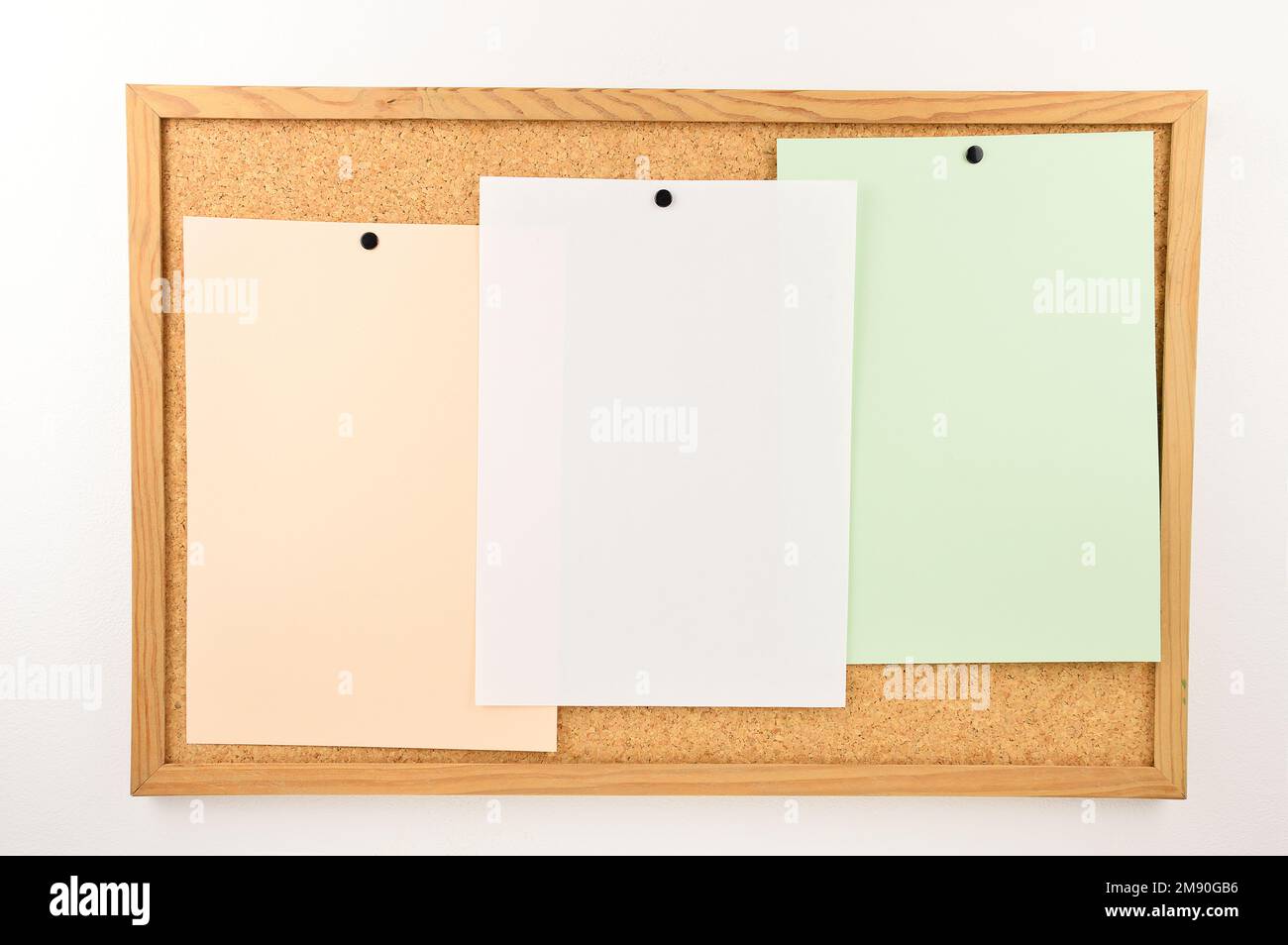 close up of thumbtack and three notes on billboard Stock Photo - Alamy