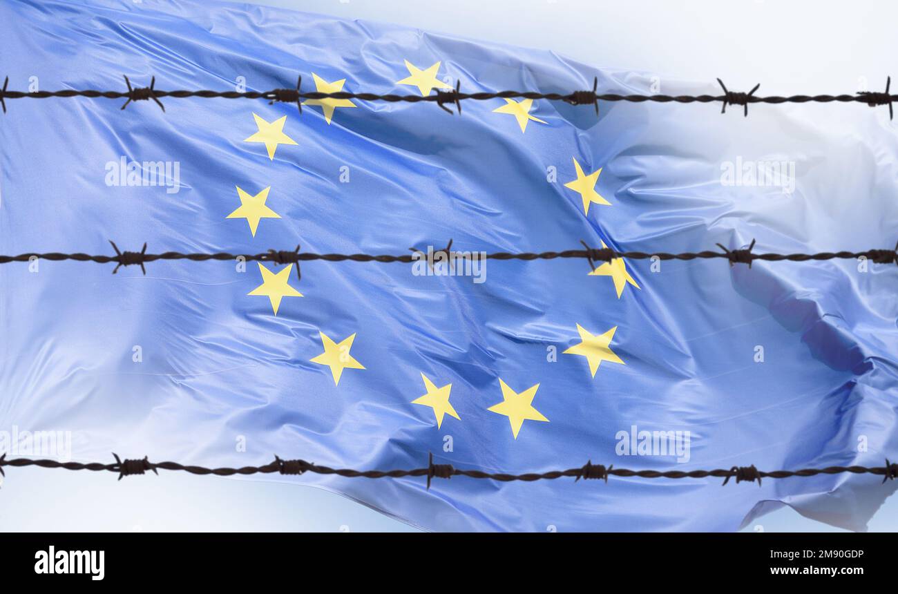 Metal fence with barbed wire on a Europe flag. Separation concept ...