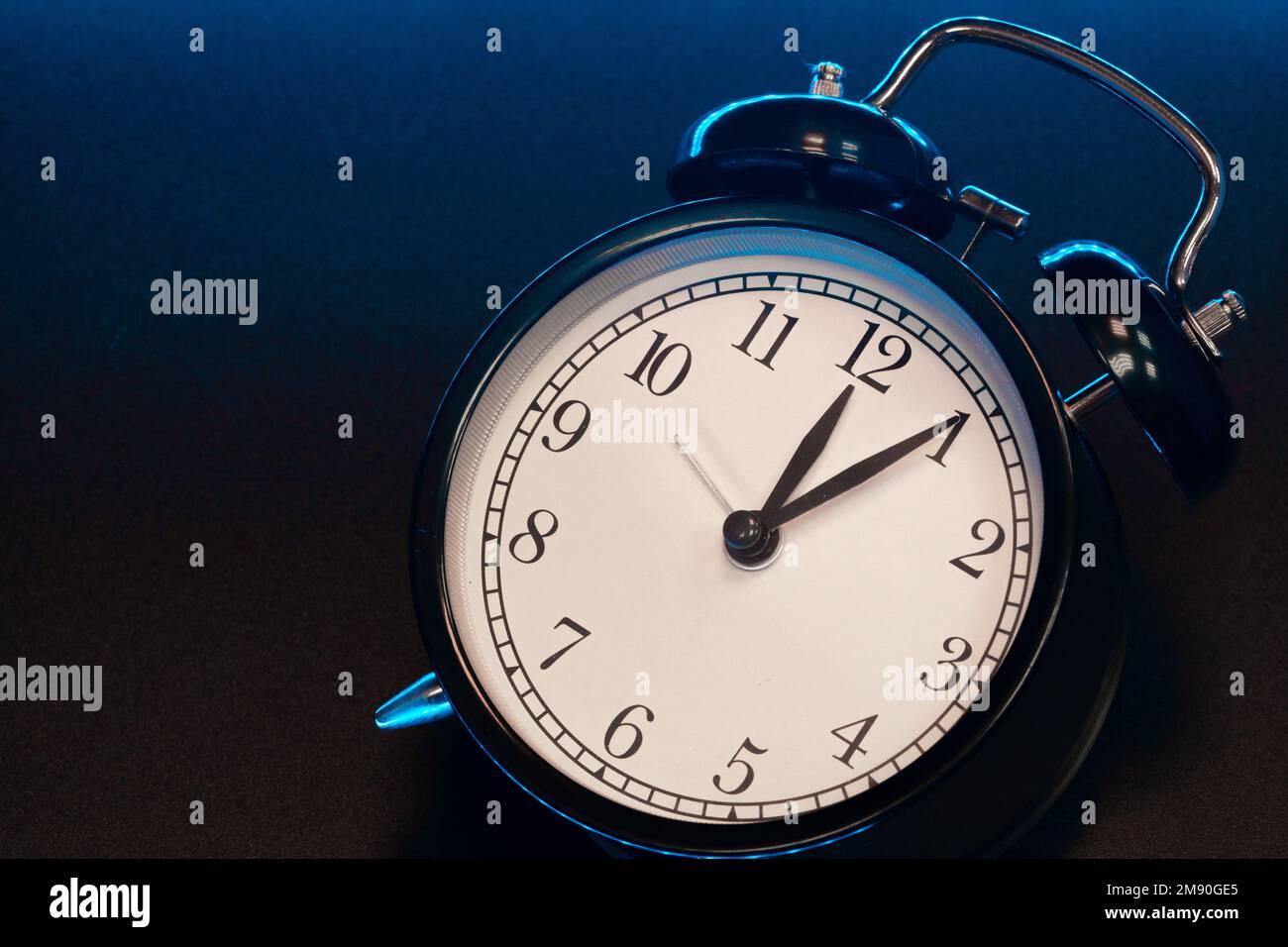 Alarm clock close up on black background Stock Photo - Alamy