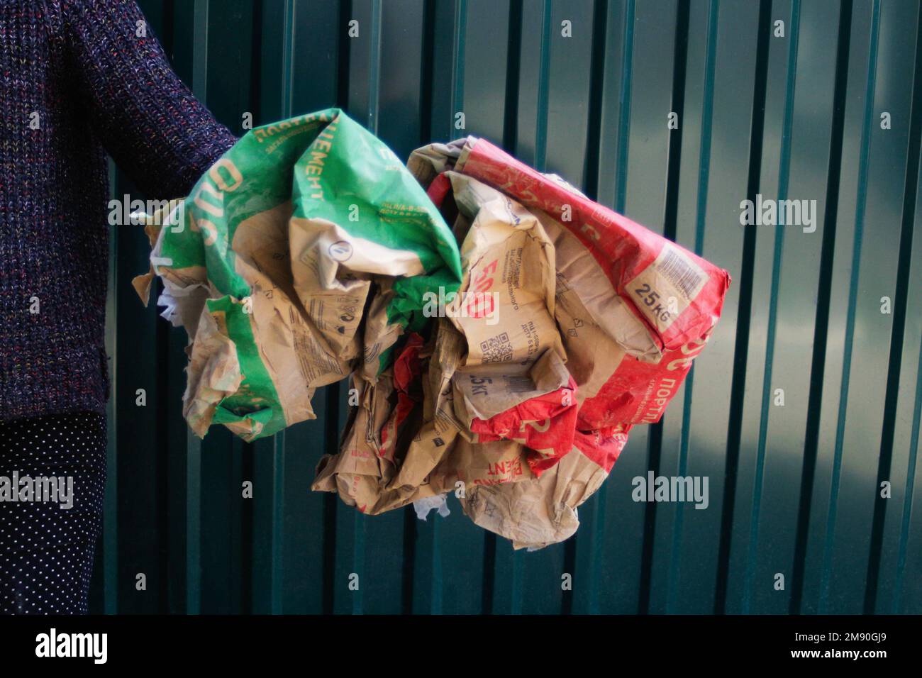 Separate collection of paper garbage. Human hands holding paper stuff ...