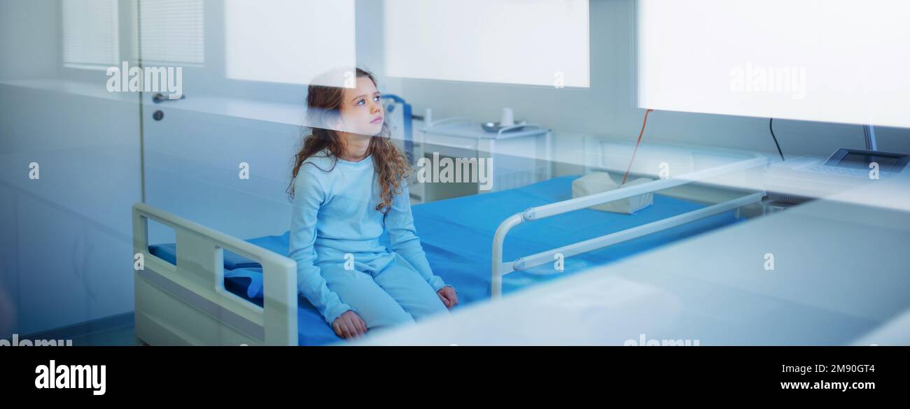 Little sick girl sitting alone in hospital ward Stock Photo - Alamy