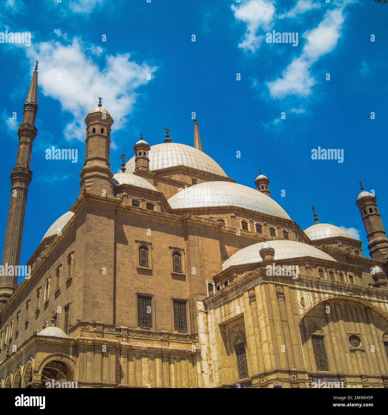The Mosque of Muhammad Ali under a blue sky and sunlight in Egypt Stock ...