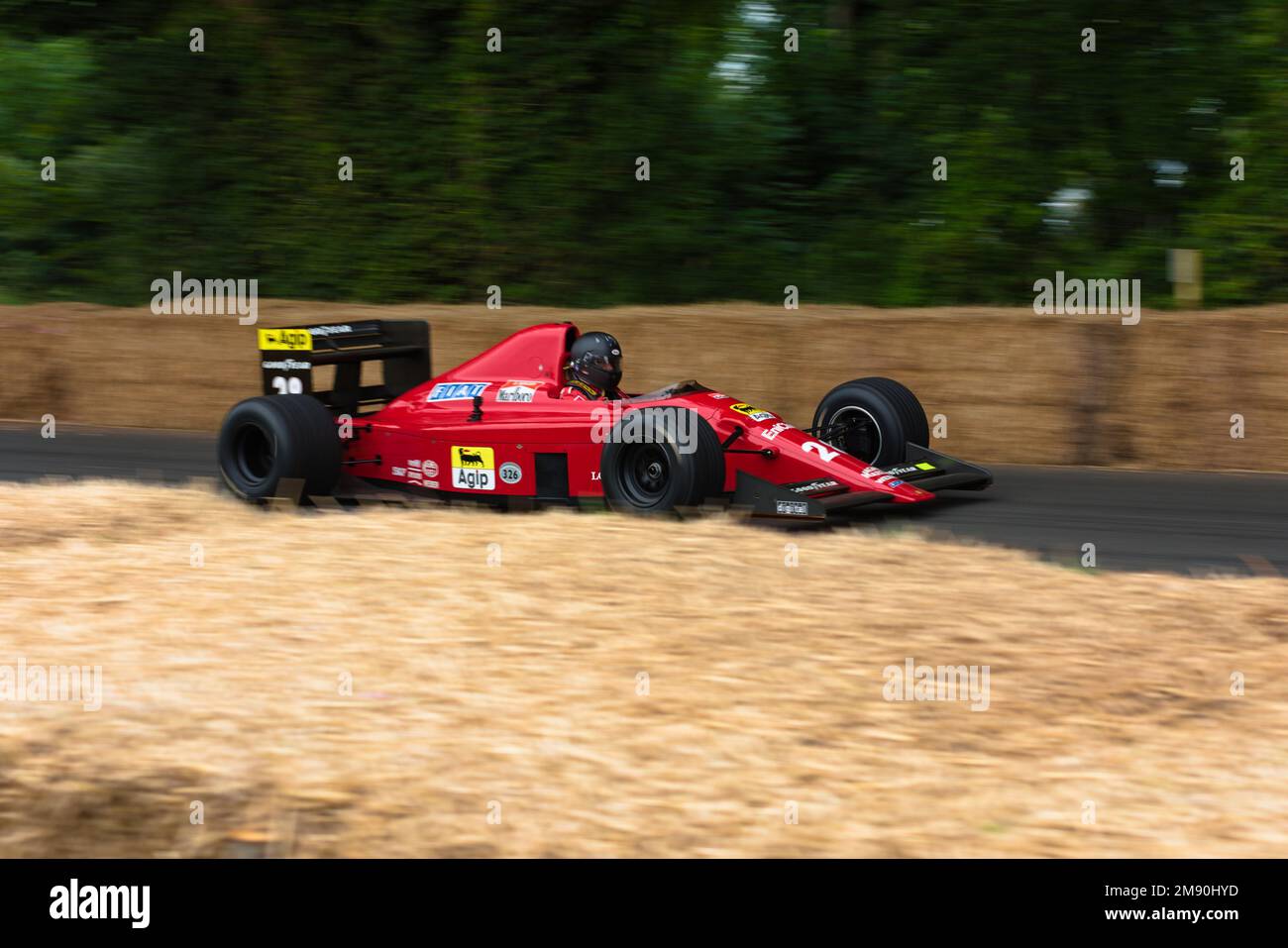 An old Ferrari Formula 1 car going up the hill climb Stock Photo - Alamy
