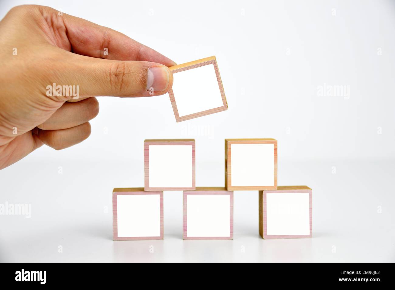 Hand arranging block stacking as building. Business concept for growth ...