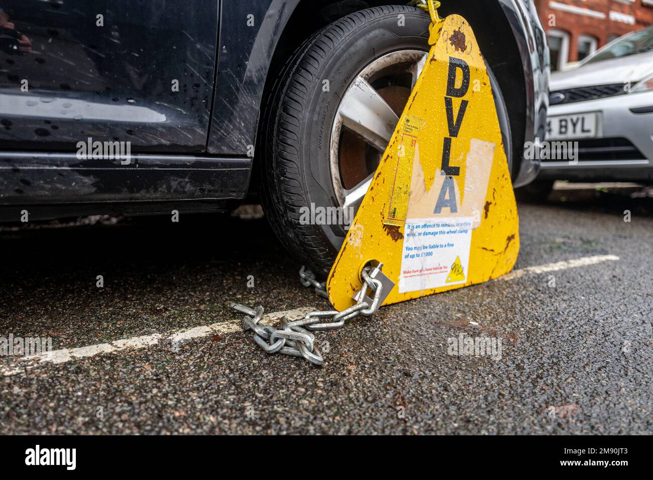 Brighton, January 11th 2023: A DVLA parking clamp on a vehicle on the ...