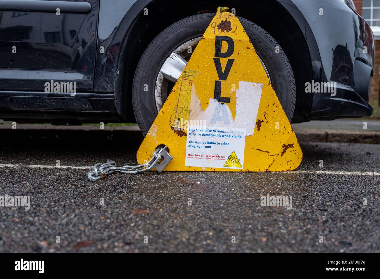 Brighton, January 11th 2023: A DVLA parking clamp on a vehicle on the ...