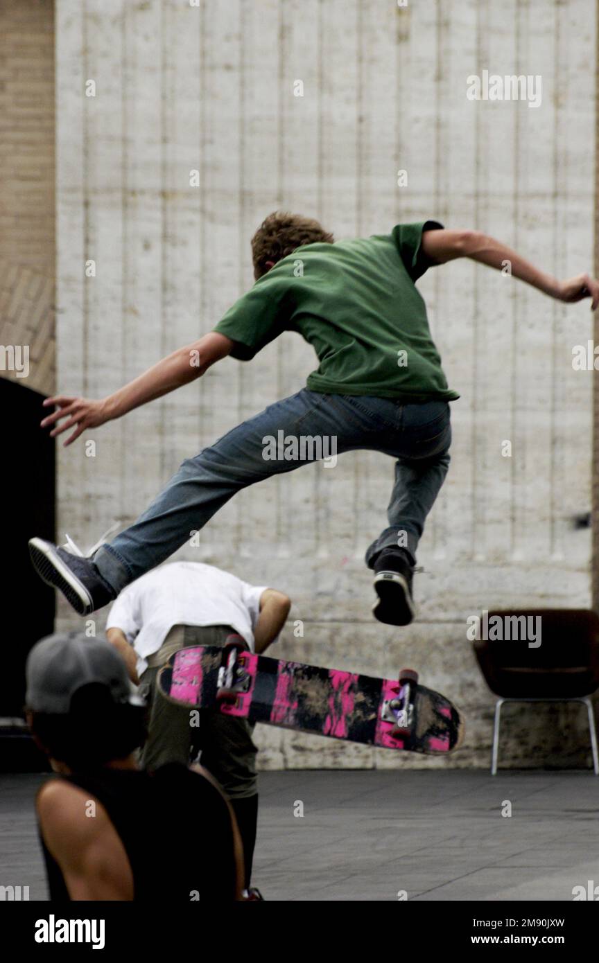 Kids practice their skateboard moves outside the Museum of Modern Art ...