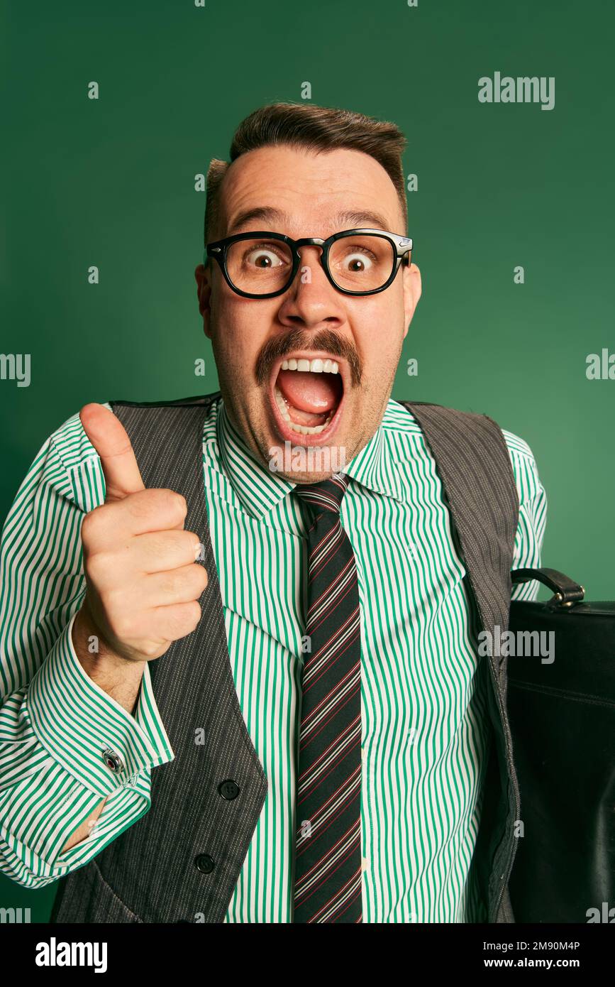 Positive excitement. Portrait of handsome man, businessman in classical ...