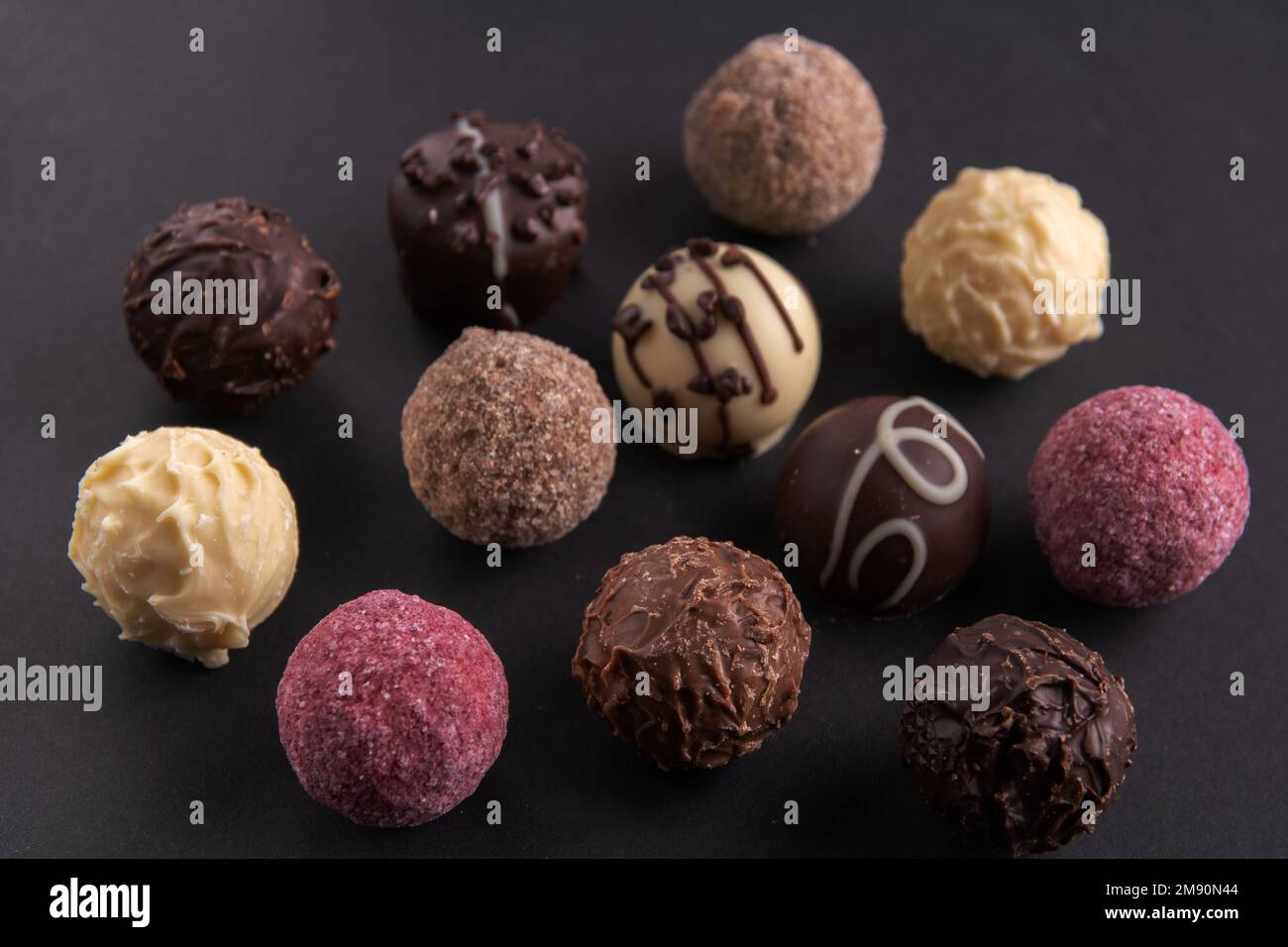 photo chocolate sweets of different colors lying next to each other on ...