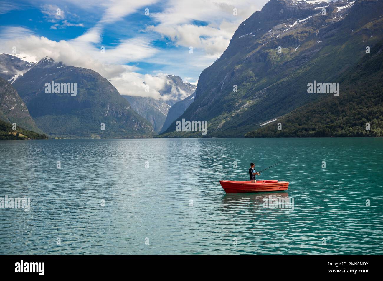 Woman fishing on a boat. Beautiful Nature Norway natural landscape ...