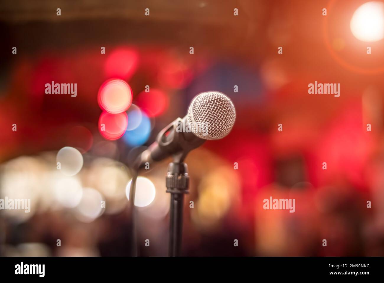 Public performance on stage Microphone on stage against a background of ...