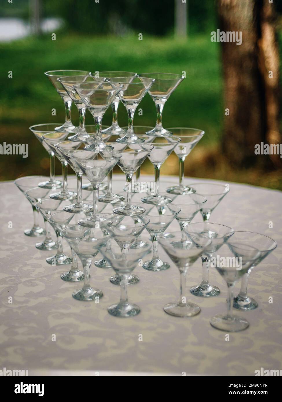pyramid of Martini glasses on the table for a festive reception Stock ...