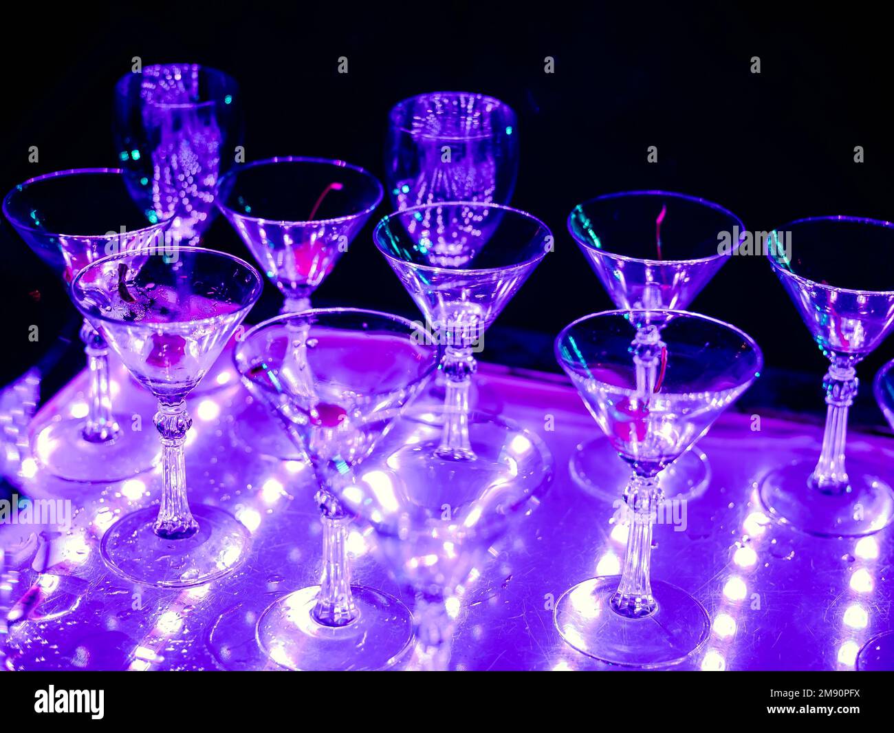 empty glasses of Martini cocktails in the nightclub at a party Stock ...