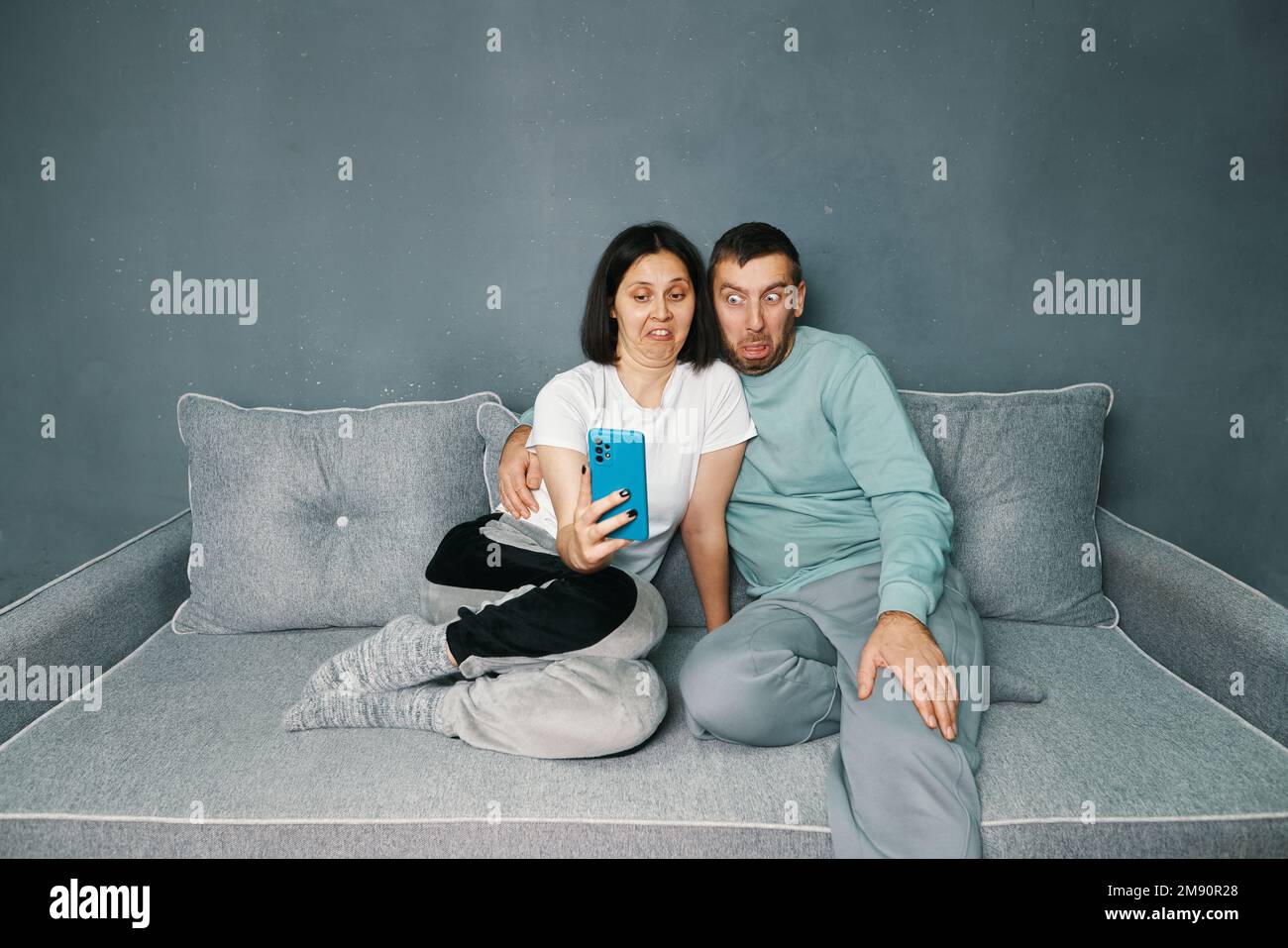 Millennial couple with disgust face expression because aversion ...