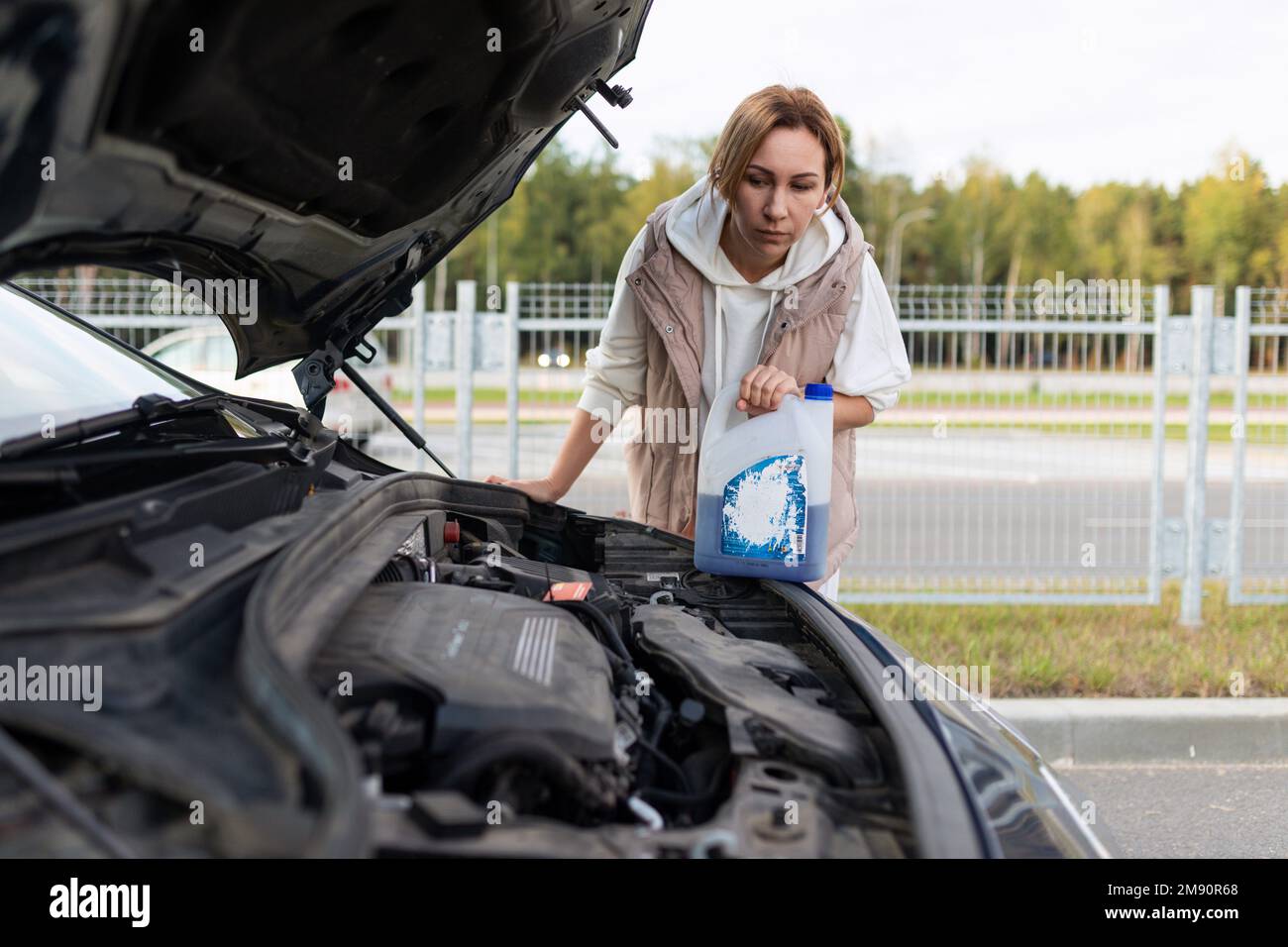 Parked car crash woman hi-res stock photography and images - Alamy