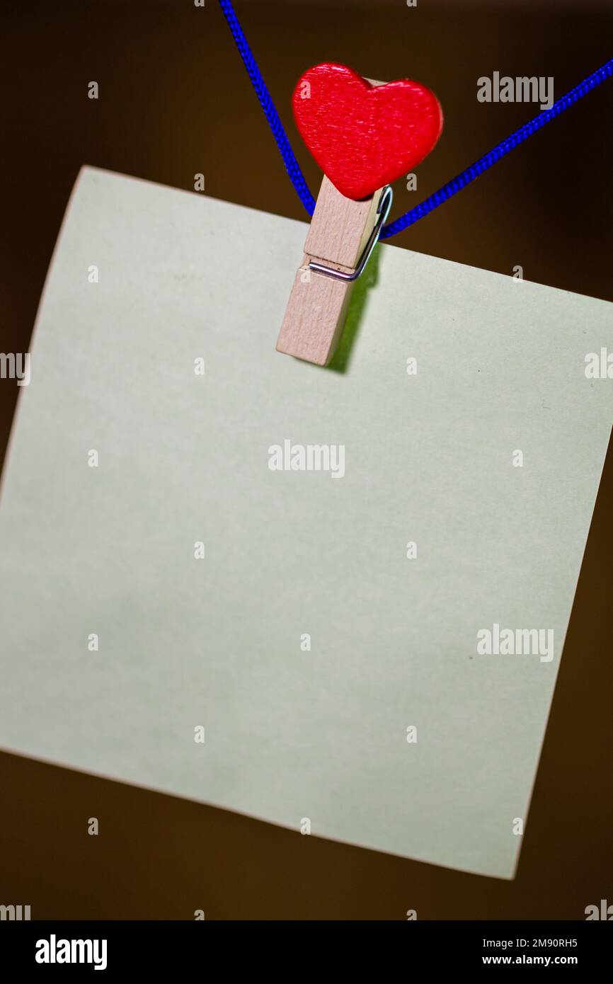 Heart clothes peg holding note with blank copy space Stock Photo - Alamy