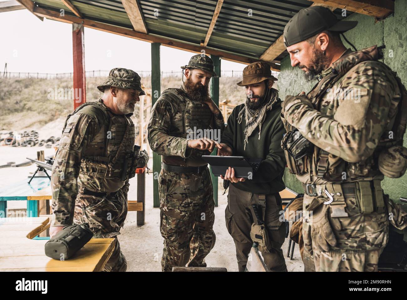 Group of soldiers discussing something before combat Stock Photo - Alamy