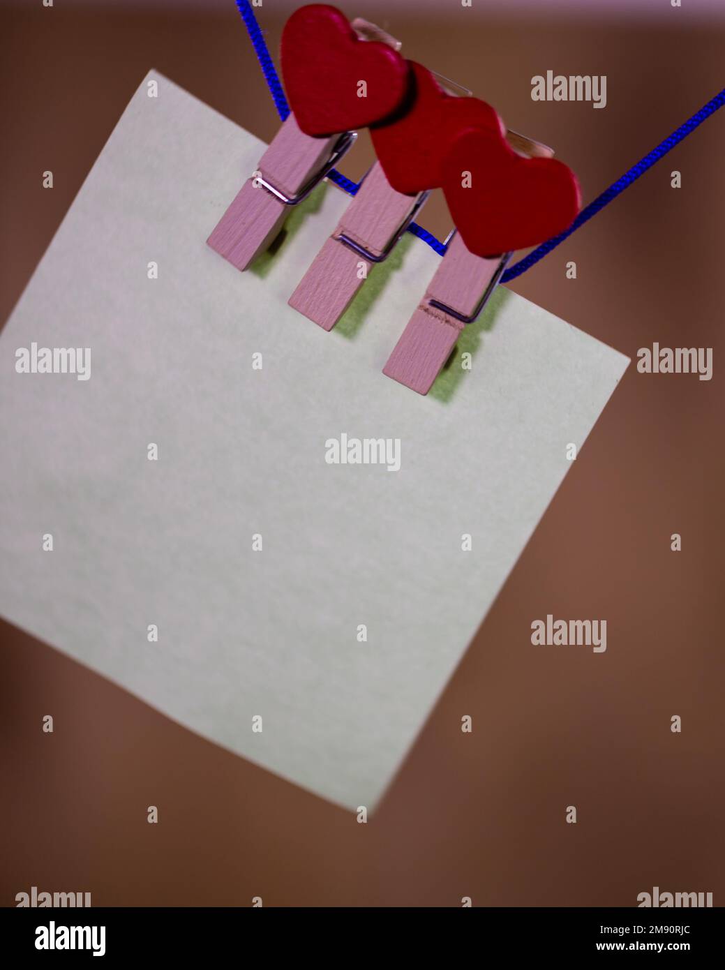 Heart clothes peg holding note with blank copy space Stock Photo - Alamy