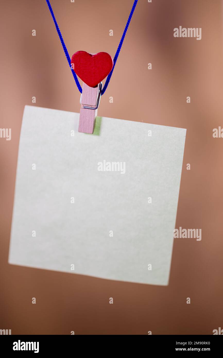 Heart clothes peg holding note with blank copy space Stock Photo - Alamy