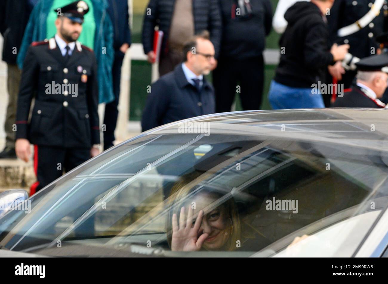 Italian Premier Giorgia Meloni waves to journalists upon her arrival at ...