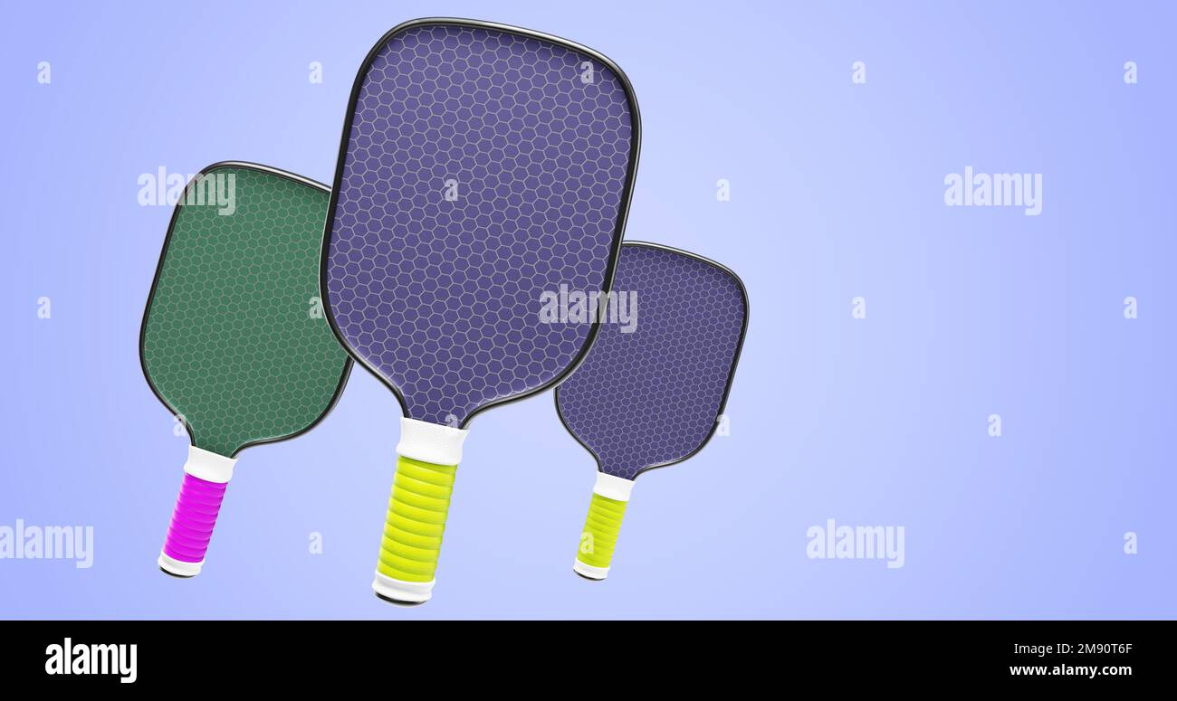 Pickleball three racket paddles on a purple background with copy space ...