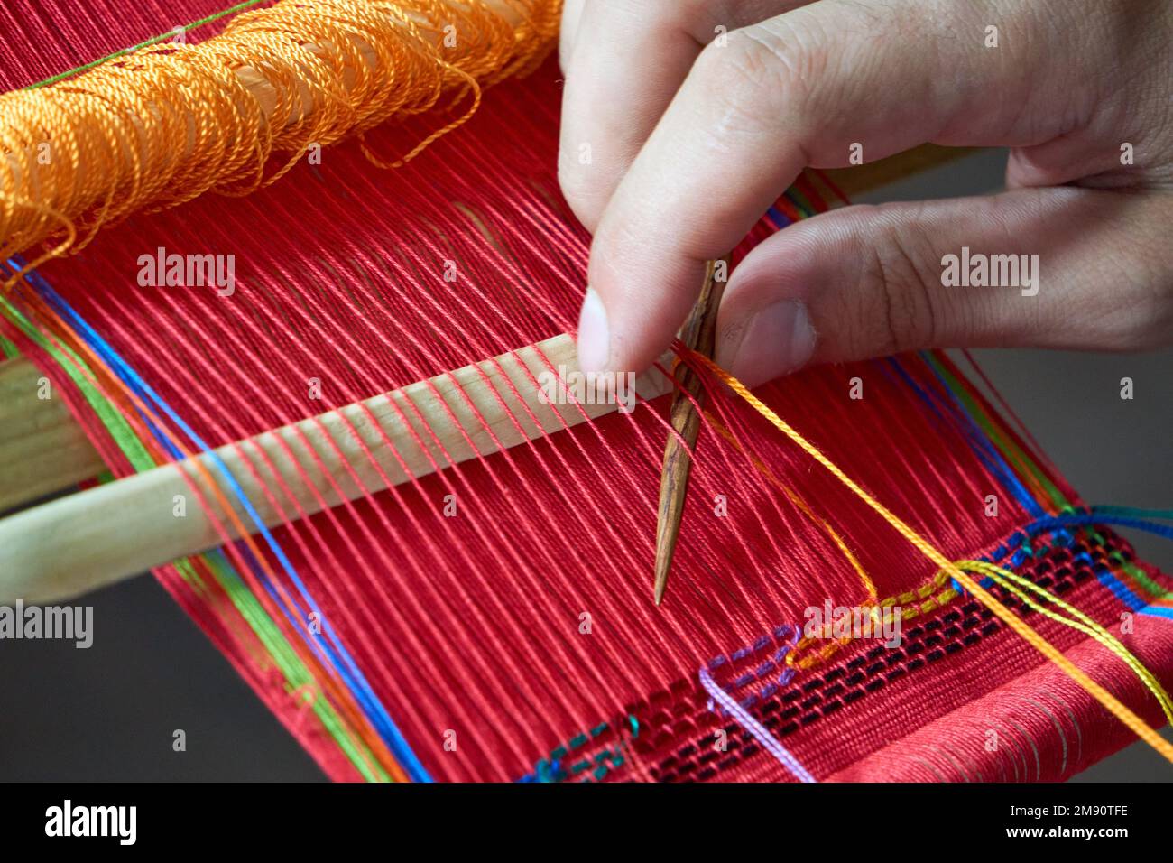 Tourist learning ancient mayan back strap weaving in rural Guatemala ...