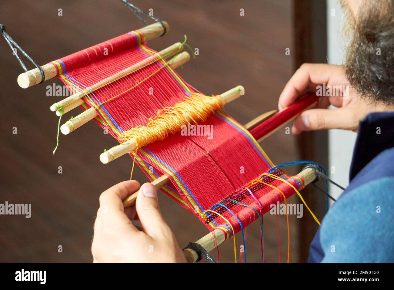 Tourist learning ancient mayan back strap weaving in rural Guatemala ...