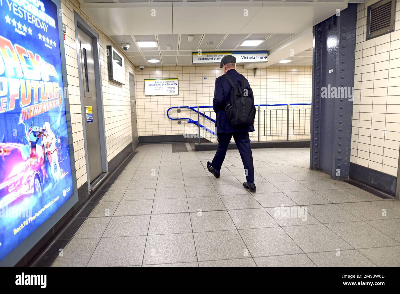 London, England, UK. Man heading the Eastbound platform of the District ...