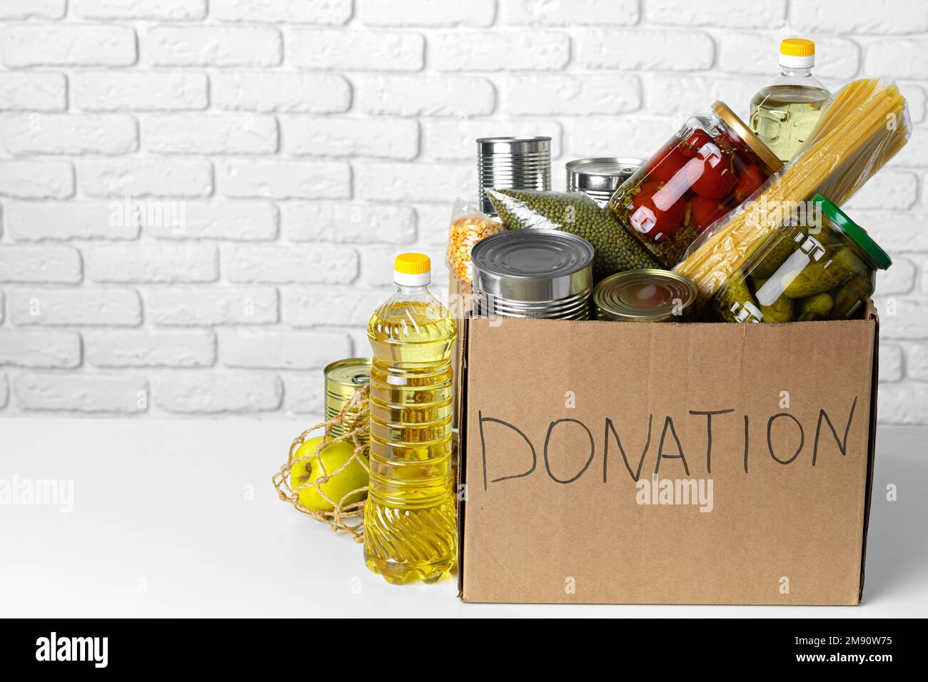 Donation box with various food. Pandemic support Stock Photo - Alamy
