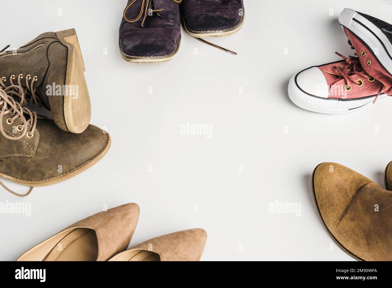 An assortment of various types of shoes on white background Stock Photo ...