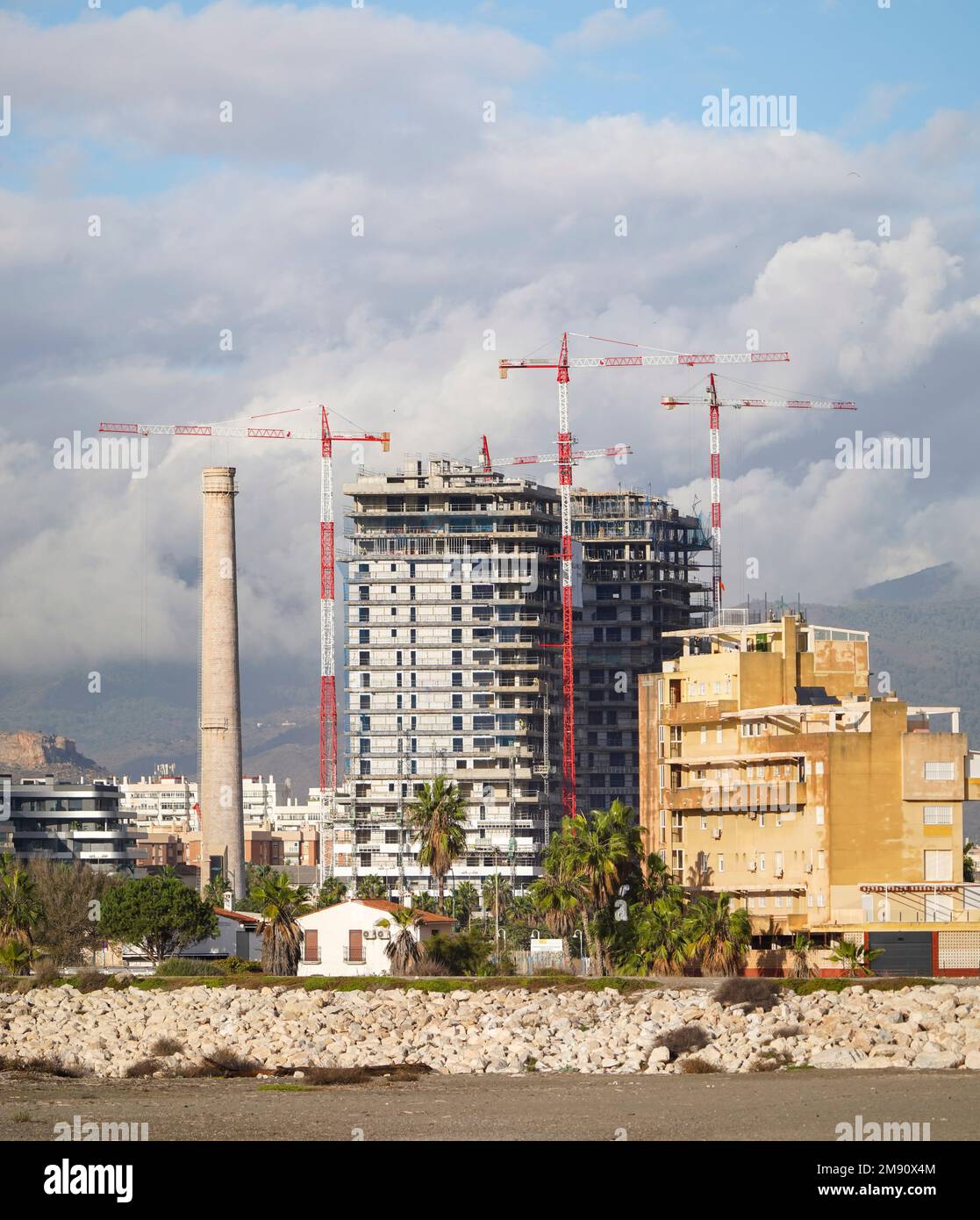 High-rise buildings, tower block, surrounded by cranes in Malaga under ...