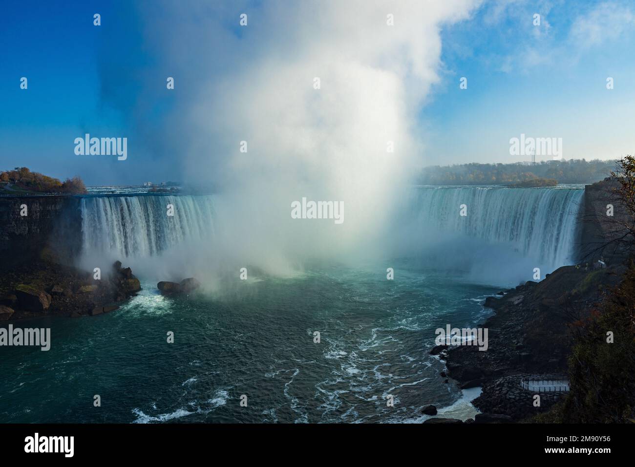 An aerial shot of Niagara Falls and steam rising from the constant flow ...