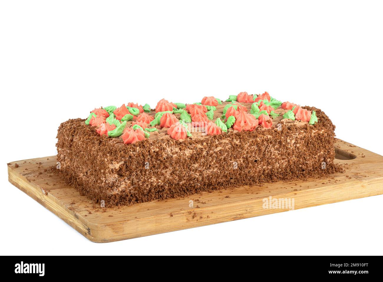 Sponge cake decorated with multi-colored buttercream flowers. Homemade ...