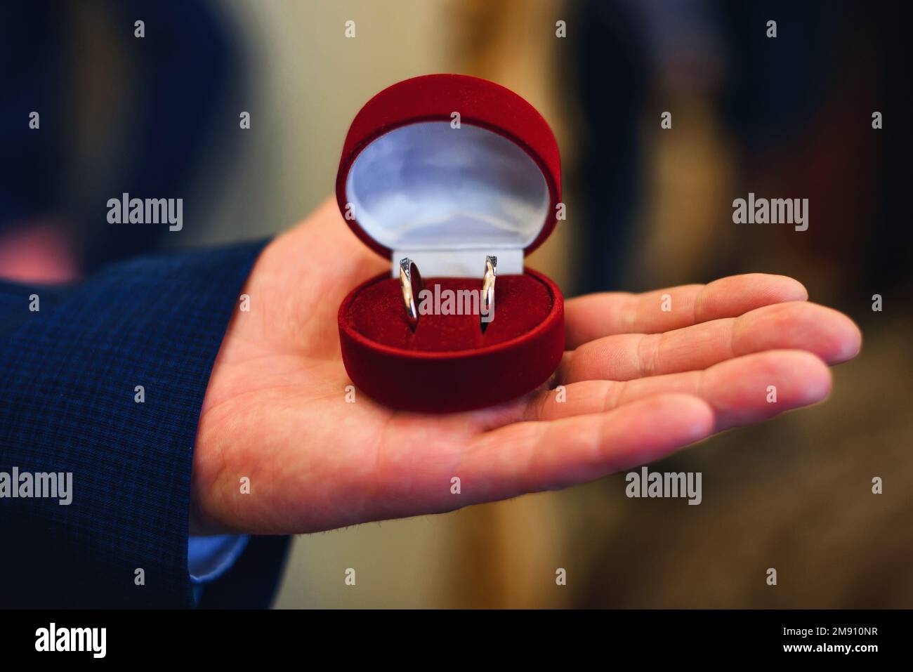 red box with wedding rings in the man's hand for marriage proposals ...