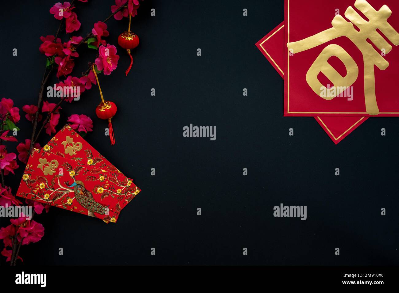 Chinese lunar new year decoration over black background. Flat lay ...